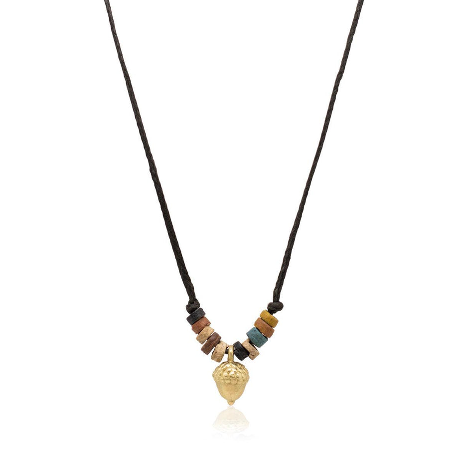 A beautiful drawstring necklace with Gold acorn pendant combined with ...
